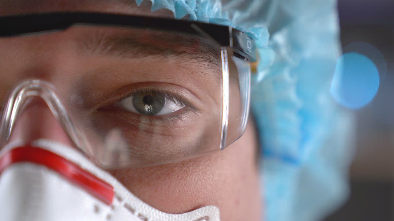 Doctor's eye with protection glasses close up - Free Stock Video