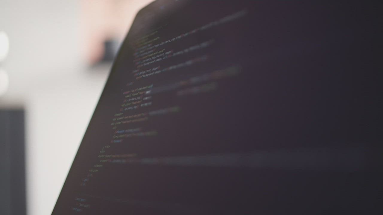 Laptop screen showing software code - Free Stock Video