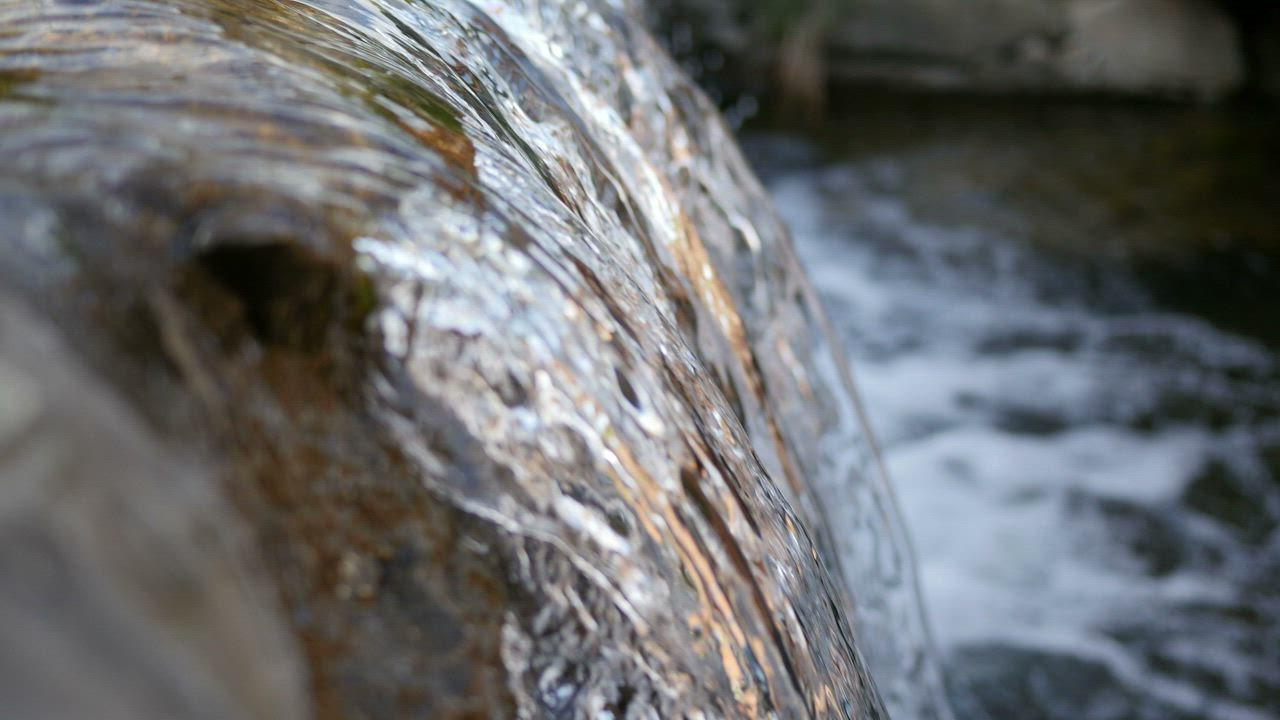 Water flowing close up - Free Stock Video