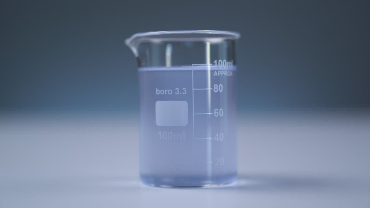 Measurement flask on the table - Free Stock Video