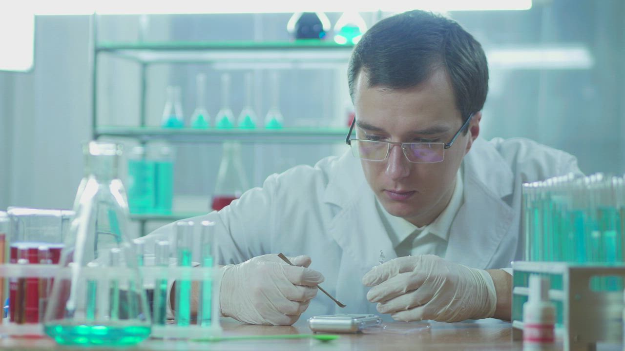 Scientist working with white powder in the lab - Free Stock Video