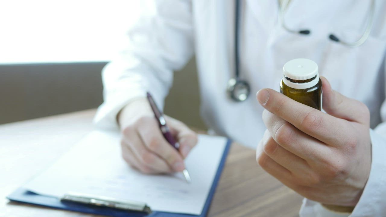 Doctor writing prescription - Free Stock Video