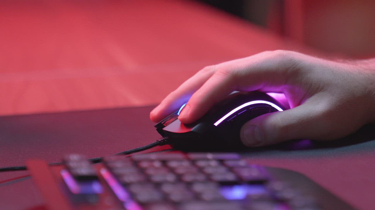 Hand using a gaming mouse with RGB lighting - Free Stock Video