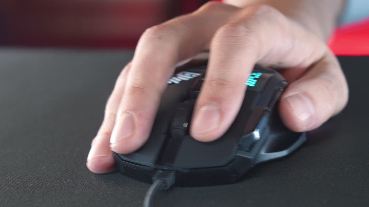 Hand using a gaming mouse with RGB neon lightings - Free Stock Video