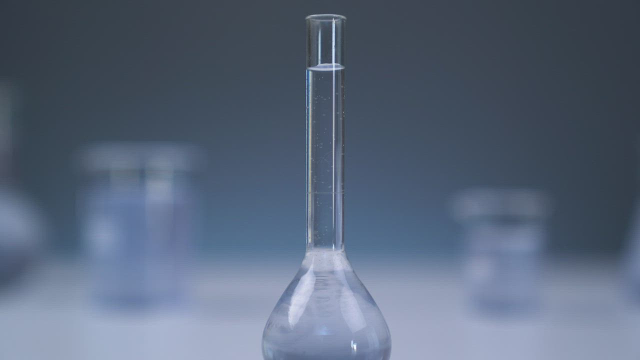 Chemistry flask on table - Free Stock Video