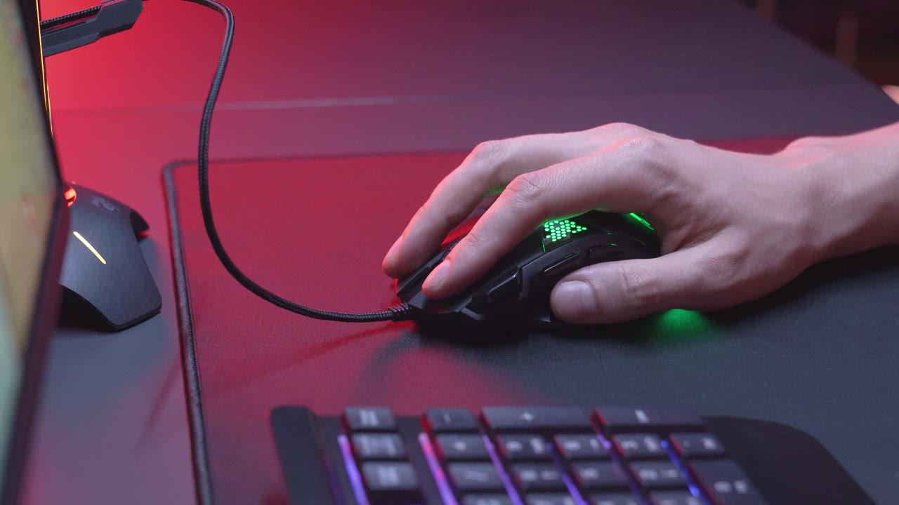 Hand using a gaming a neon lights mouse - Free Stock Video