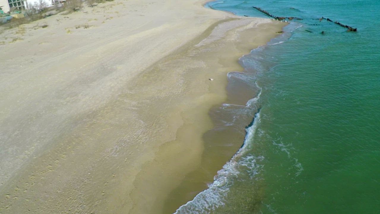 Flight over a sandy beach - Free Stock Video