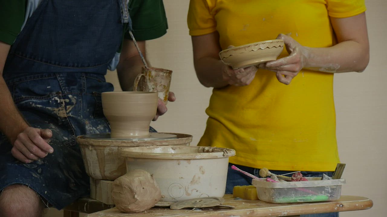 A couple of ceramic artists conversating - Free Stock Video