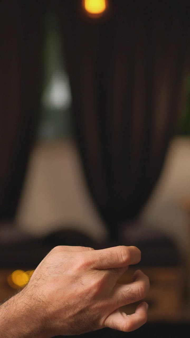 Hand of a man tossing a coin in the air - Free Stock Video