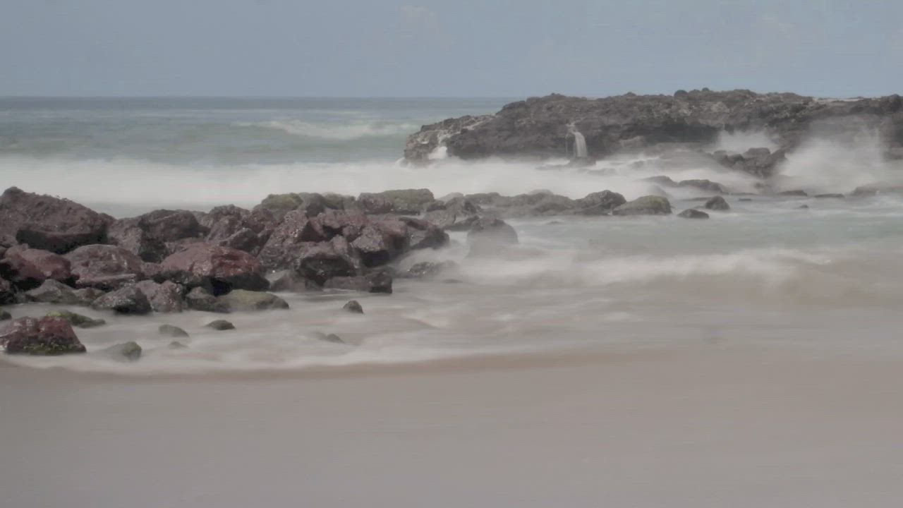 Sea waves hitting rocks - Free Stock Video