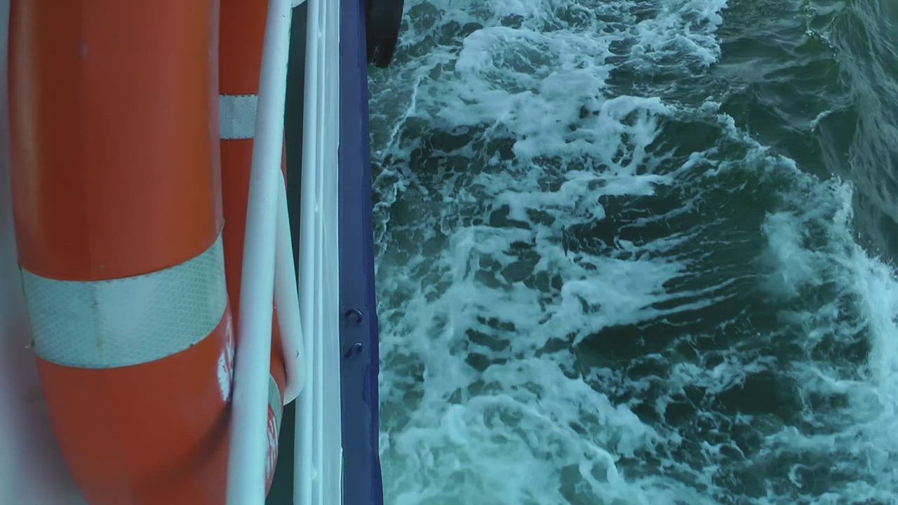 Top view towards the sea from the side of a sailing ship - Free Stock Video
