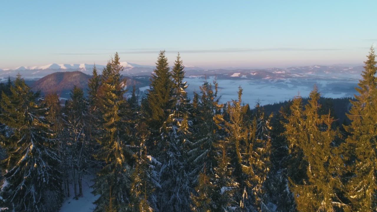 Aerial view of snowy mountains downhill - Free Stock Video