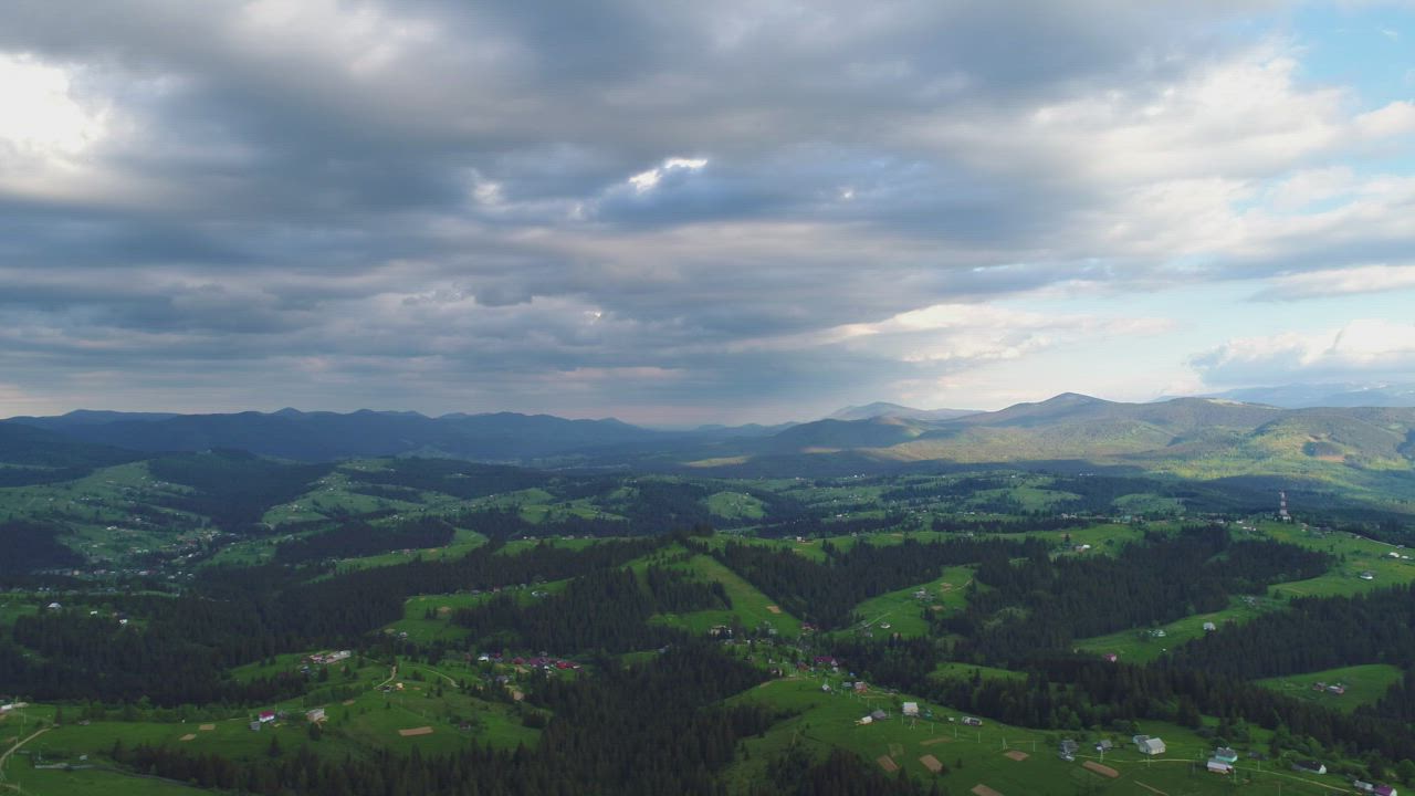 Wide aerial view of a mountainous valley, landscape - Free Stock Video