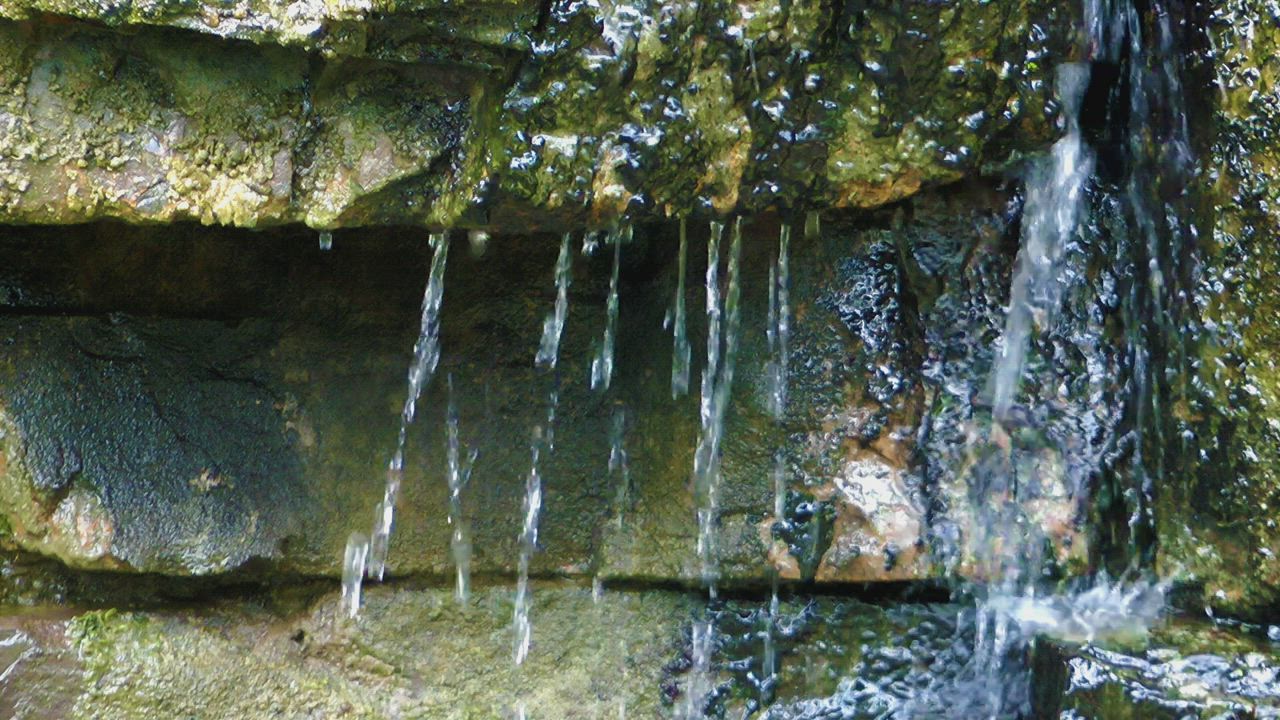 Water running off rocks - Free Stock Video