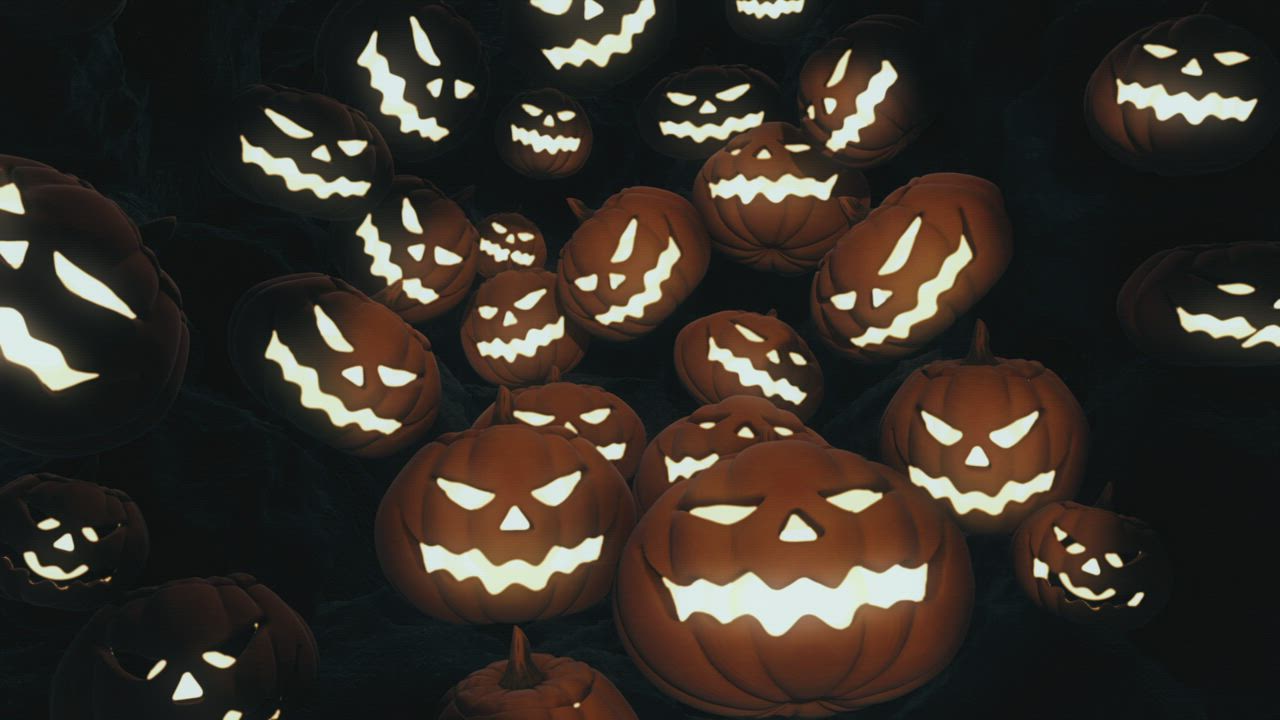 Halloween pumpkins falling in the dark - Free Stock Video