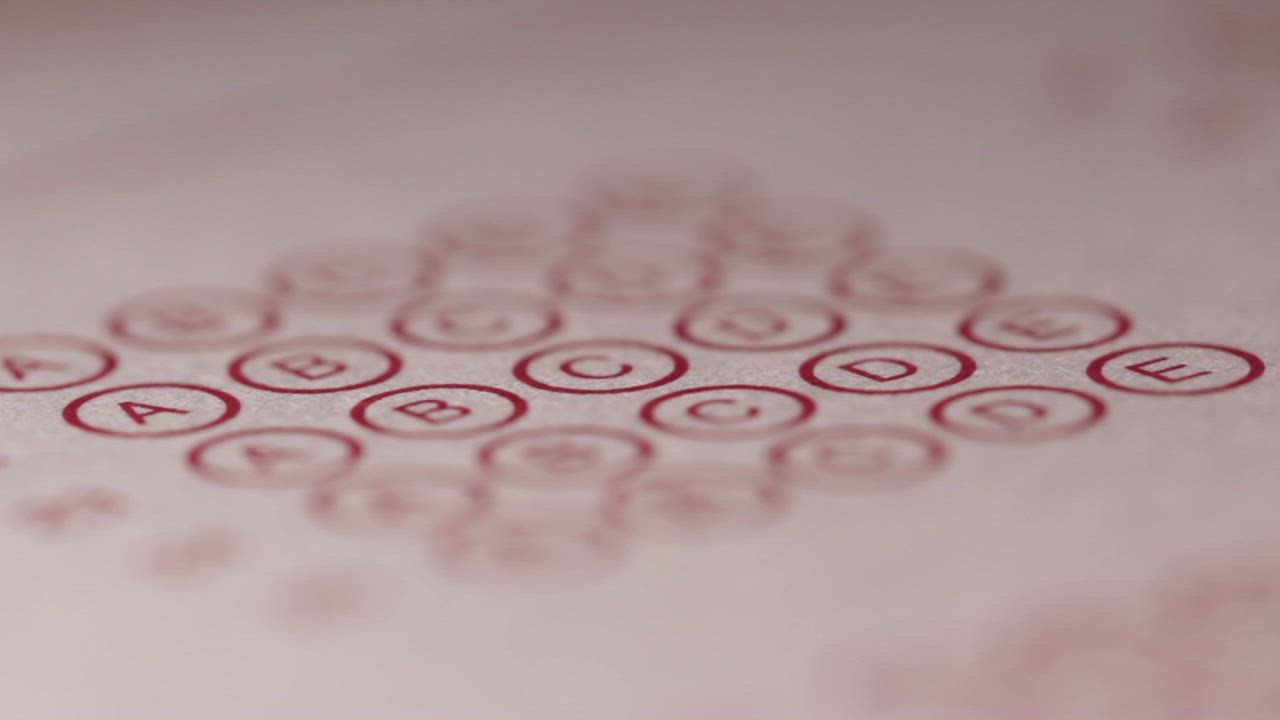 Filling in an exam paper - Free Stock Video