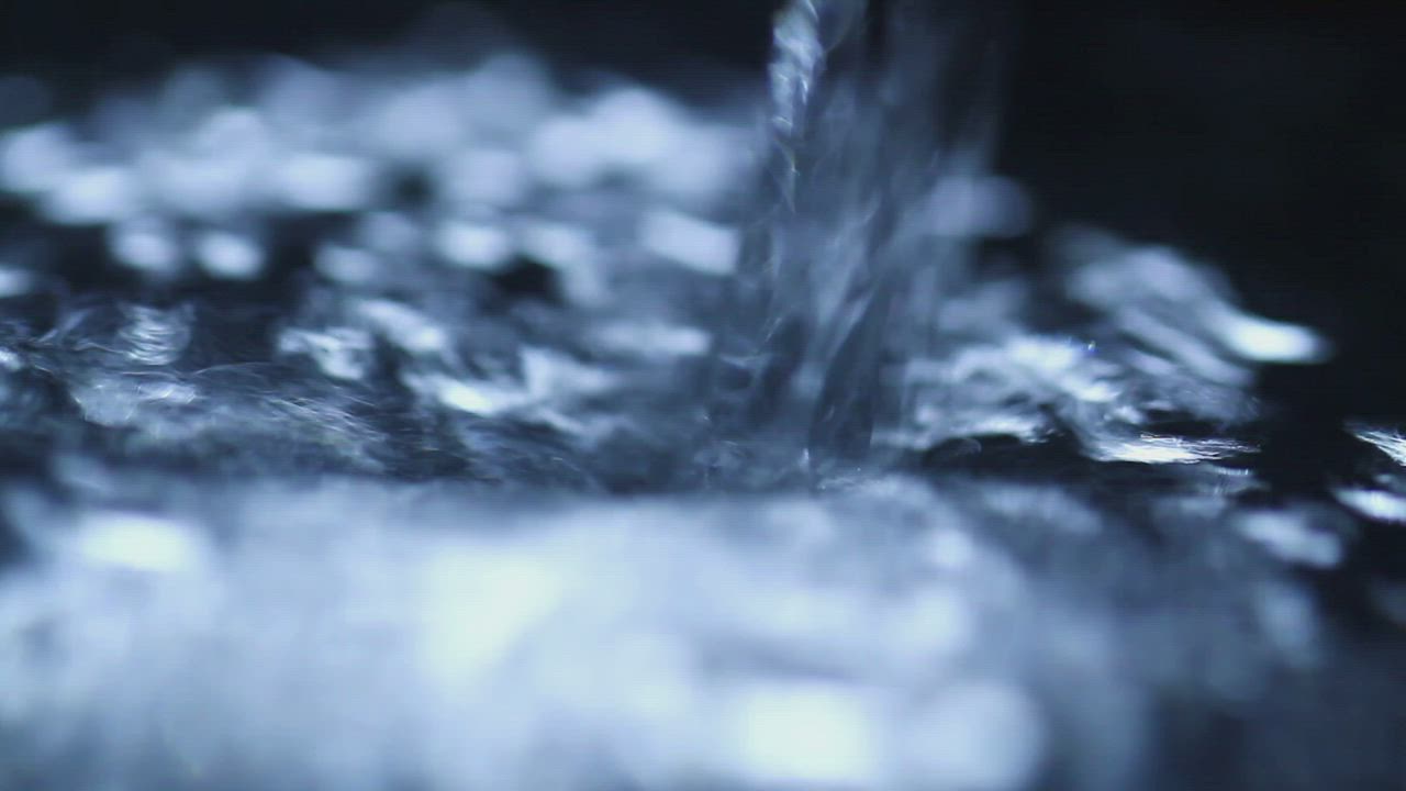 Pouring clear water from a tap - Free Stock Video