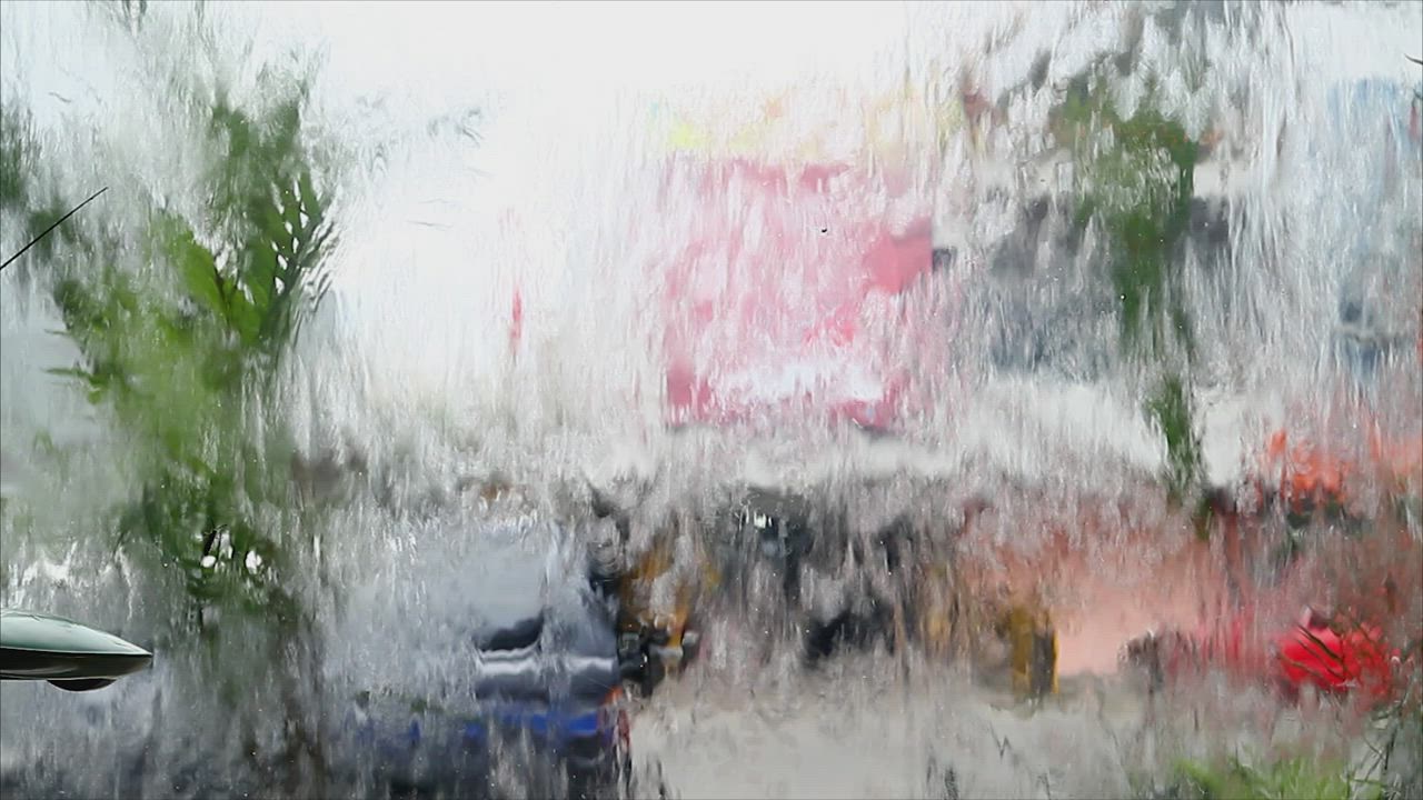 Water flowing down a window - Free Stock Video