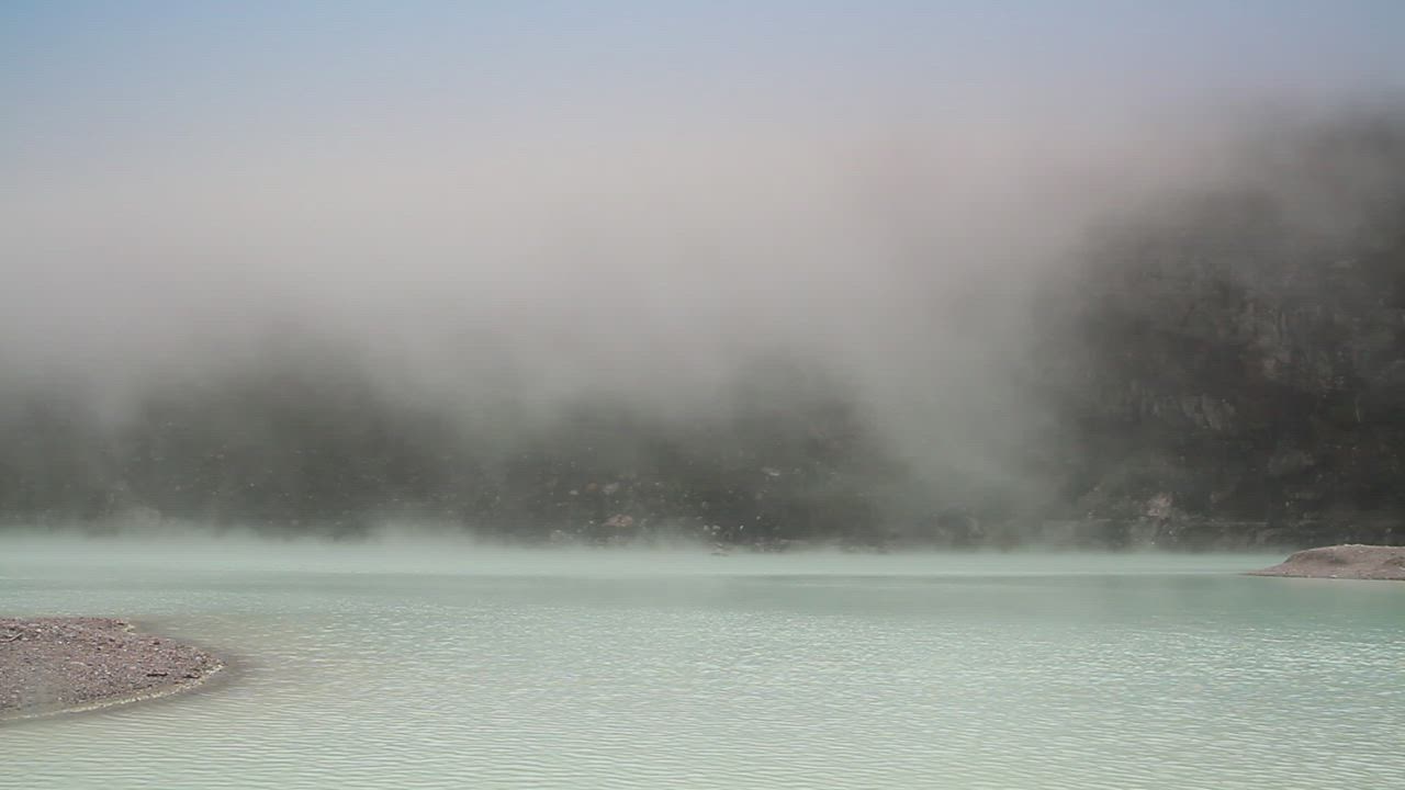 Deep fog descending across a lake - Free Stock Video