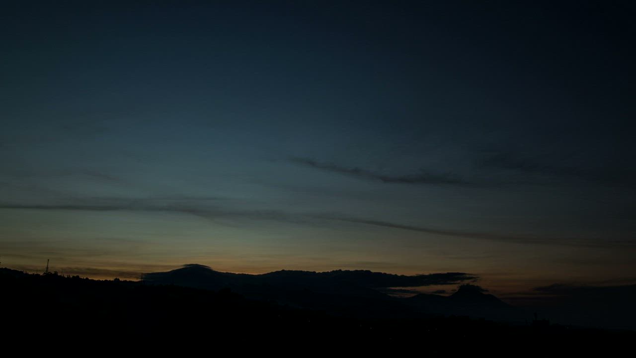 Dawn light over an island - Free Stock Video