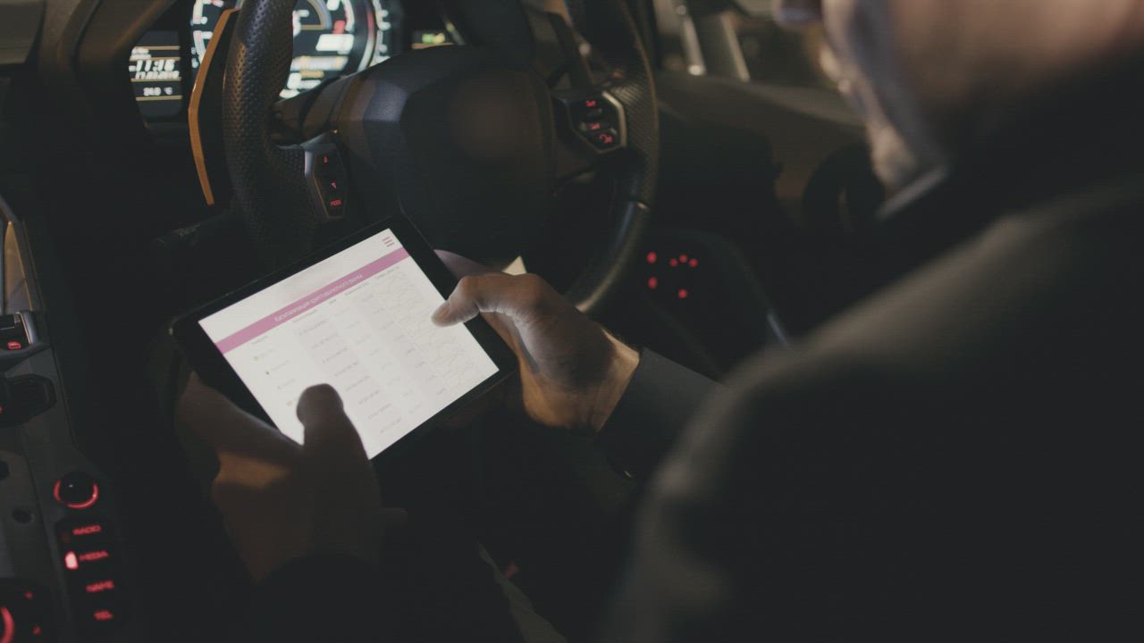 Driver using a tablet - Free Stock Video