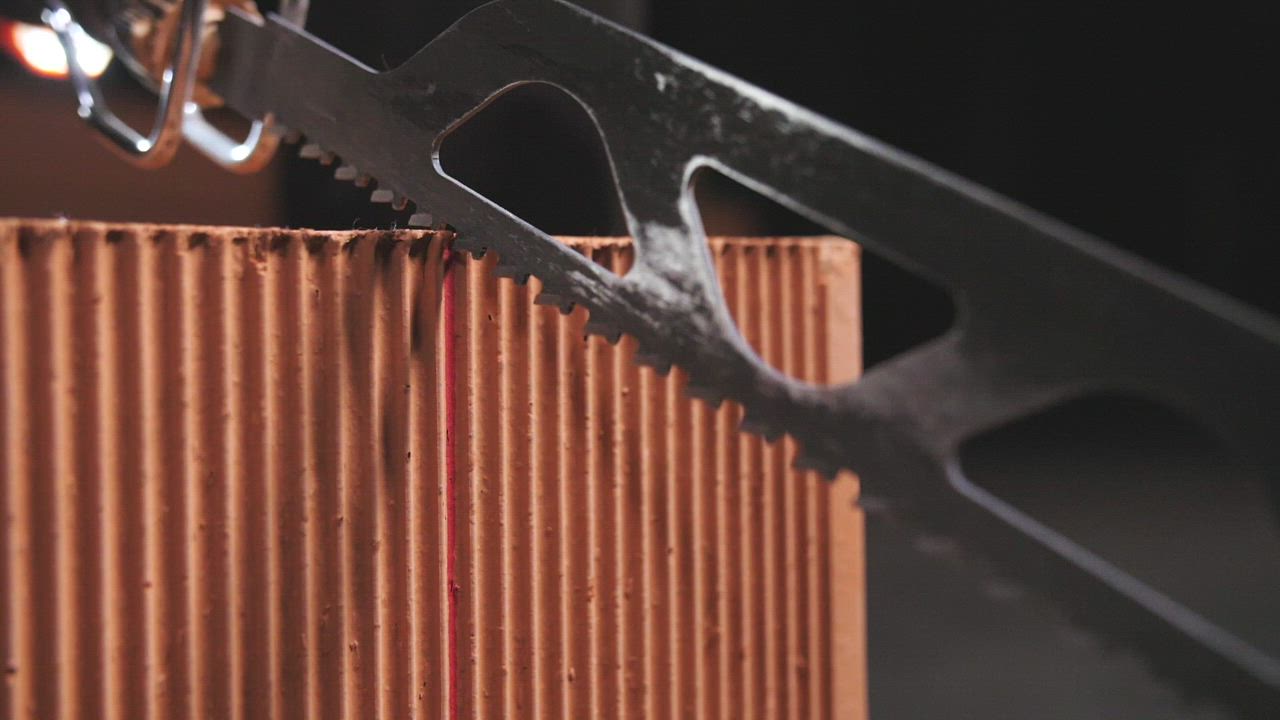 Sawing through a brick - Free Stock Video