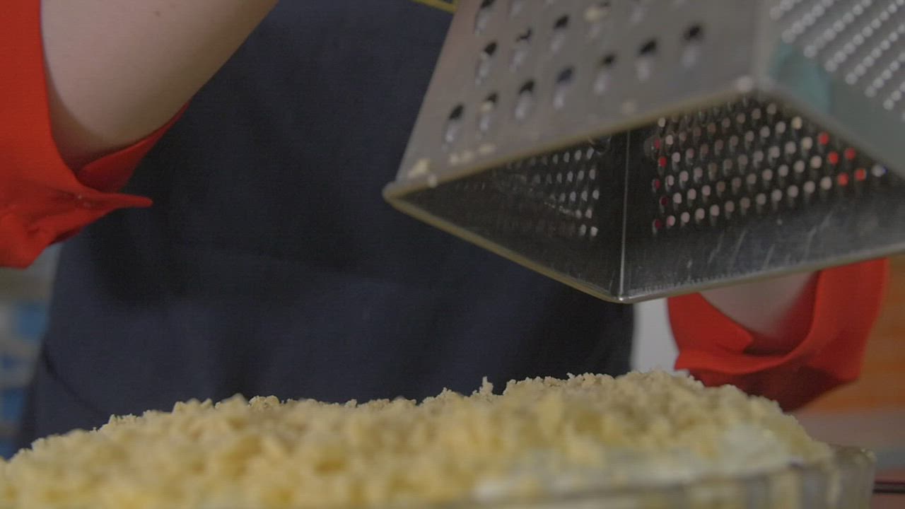 Grating food in the kitchen - Free Stock Video