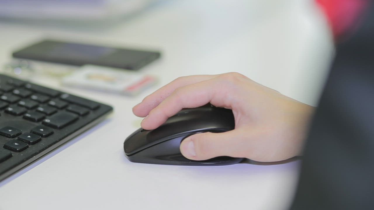 Woman using a wireless mouse - Free Stock Video