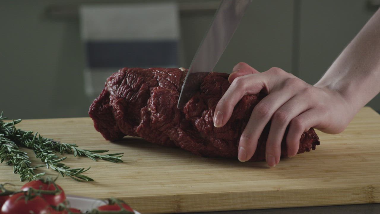 Cutting open a ham - Free Stock Video