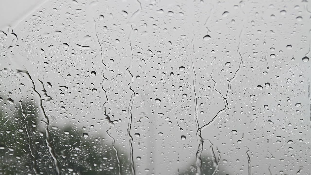 Rain hitting a window - Free Stock Video