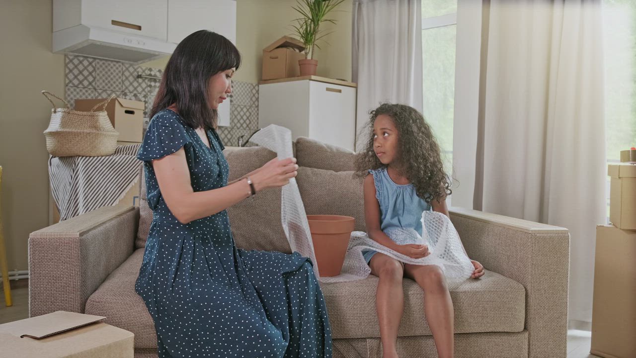 Daughter helps her mother pack - Free Stock Video