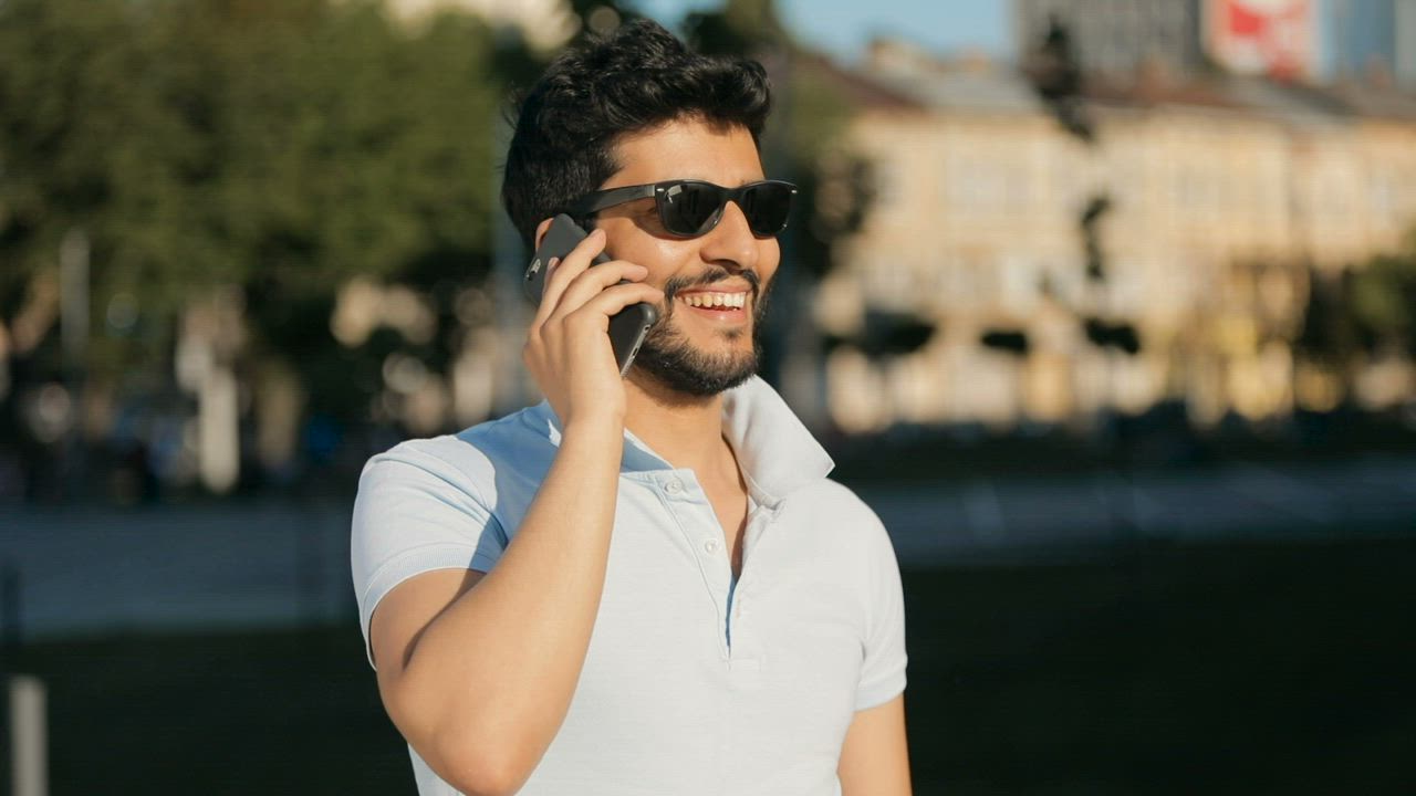 Man talking on cell phone at downtown - Free Stock Video