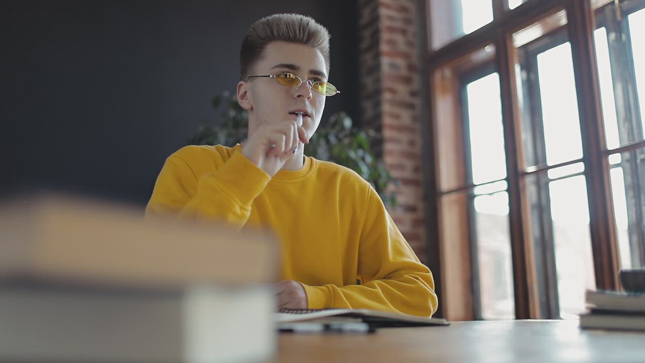 Young Student Writing In A Notebook Free Stock Video