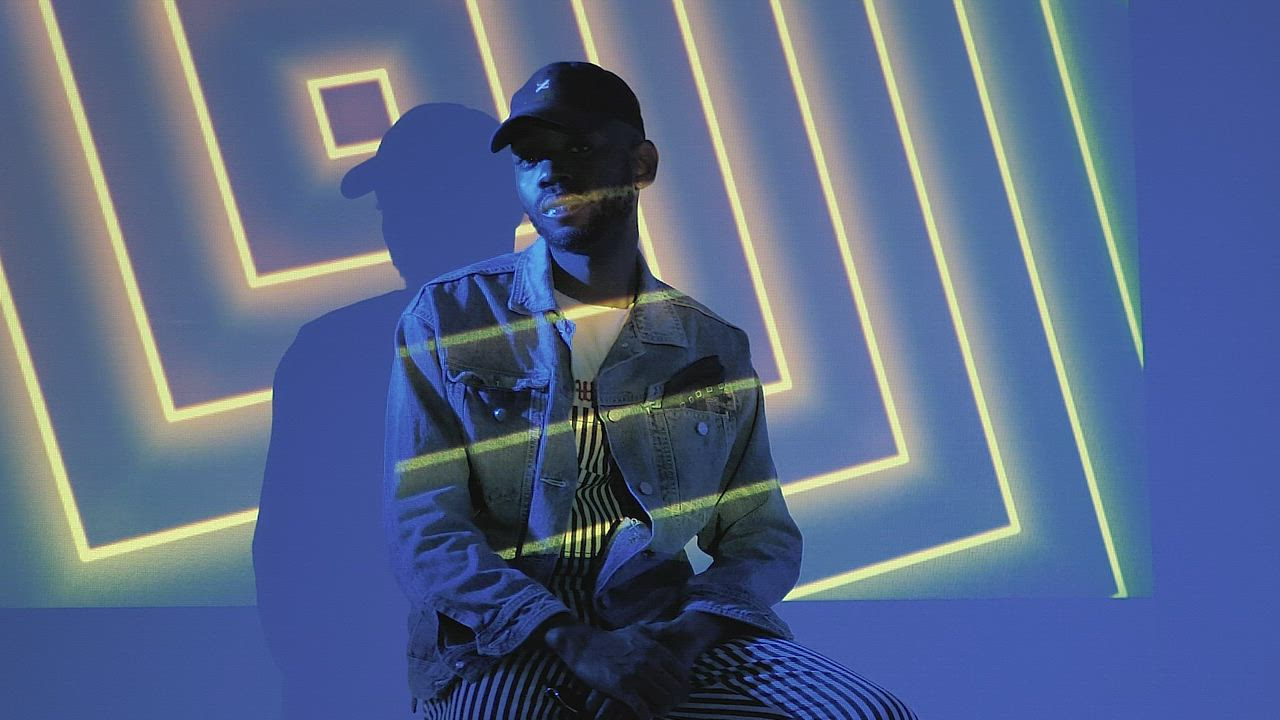 Shapes and colors projected on man - Free Stock Video