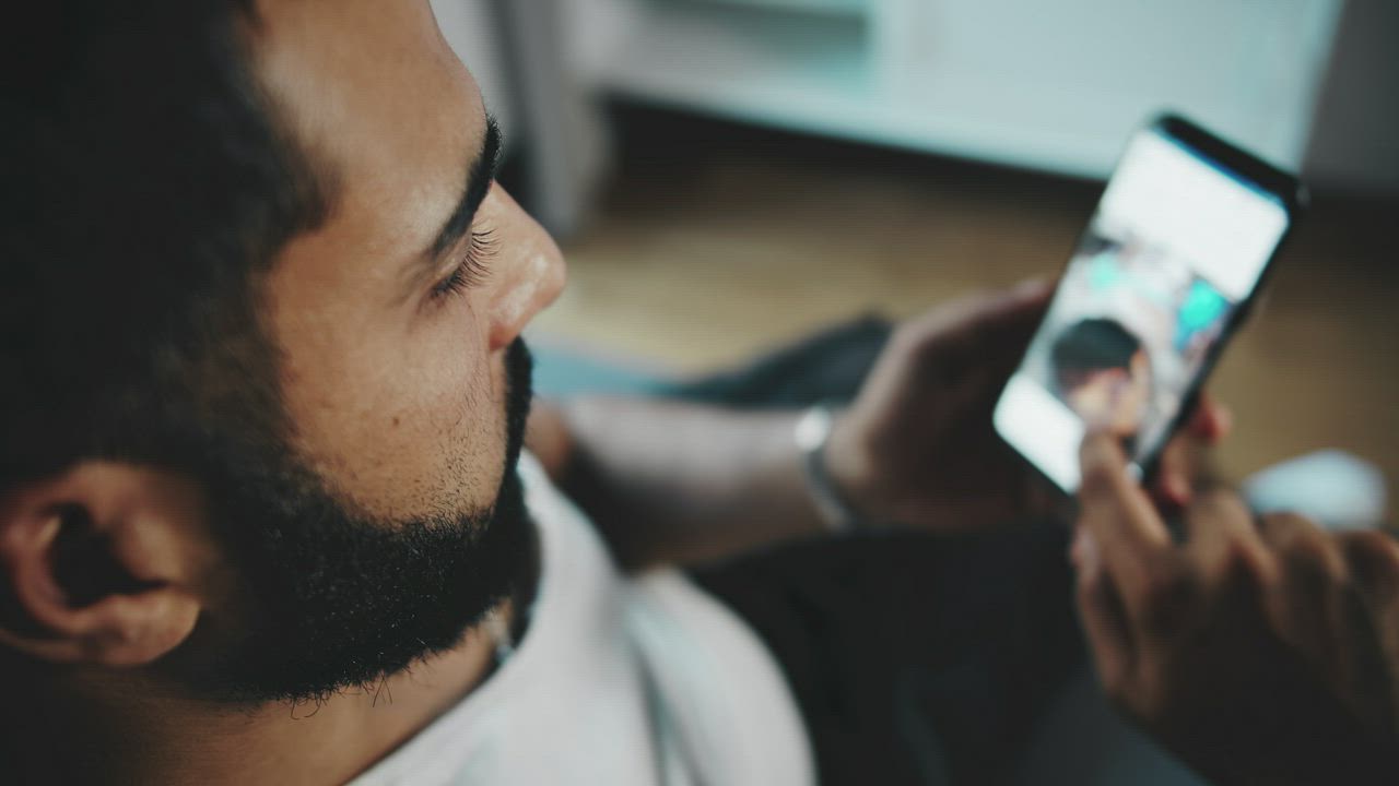 Man scrolling a social media app - Free Stock Video