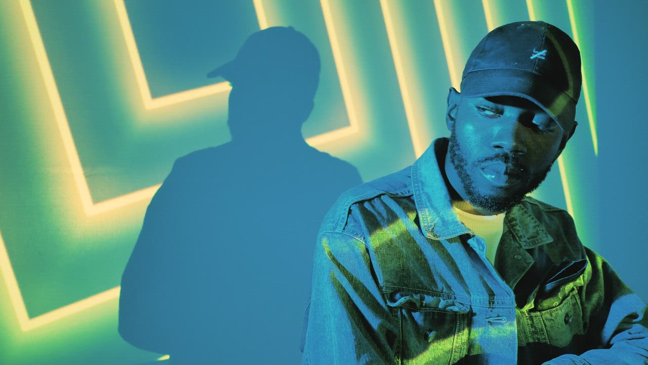 Guy lit by projected lights - Free Stock Video