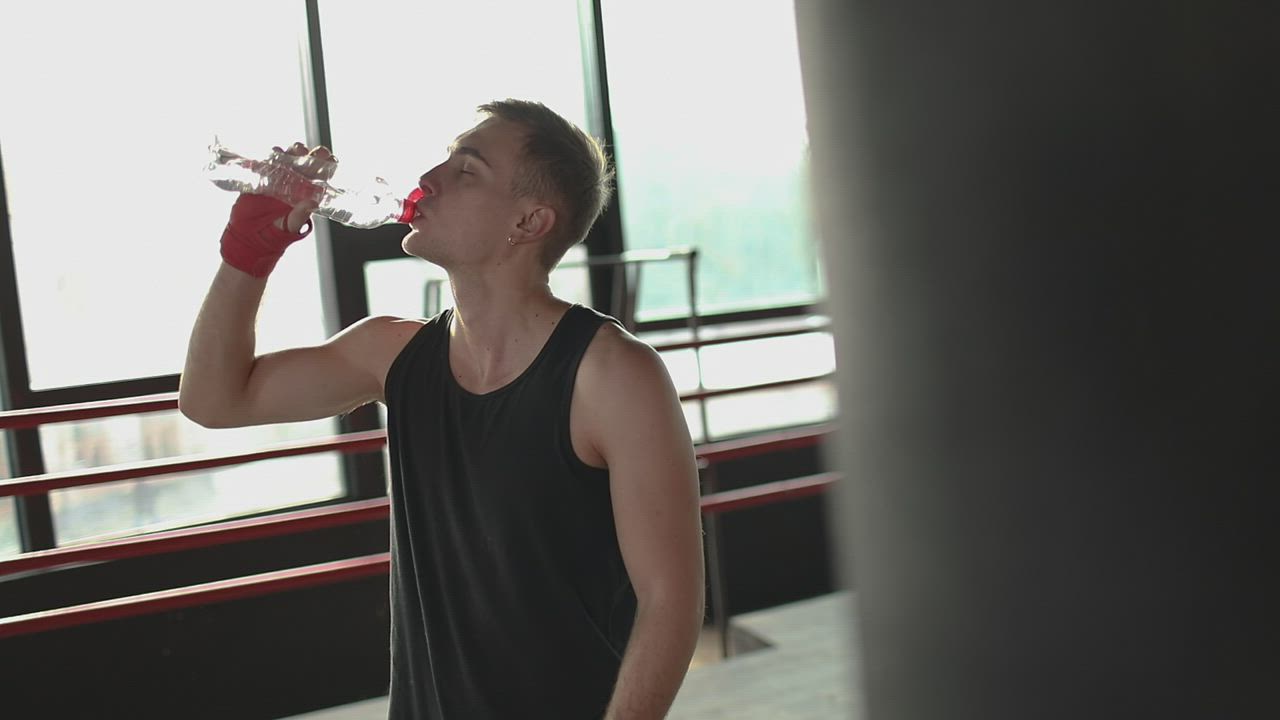 Boxer drinking water after his training - Free Stock Video