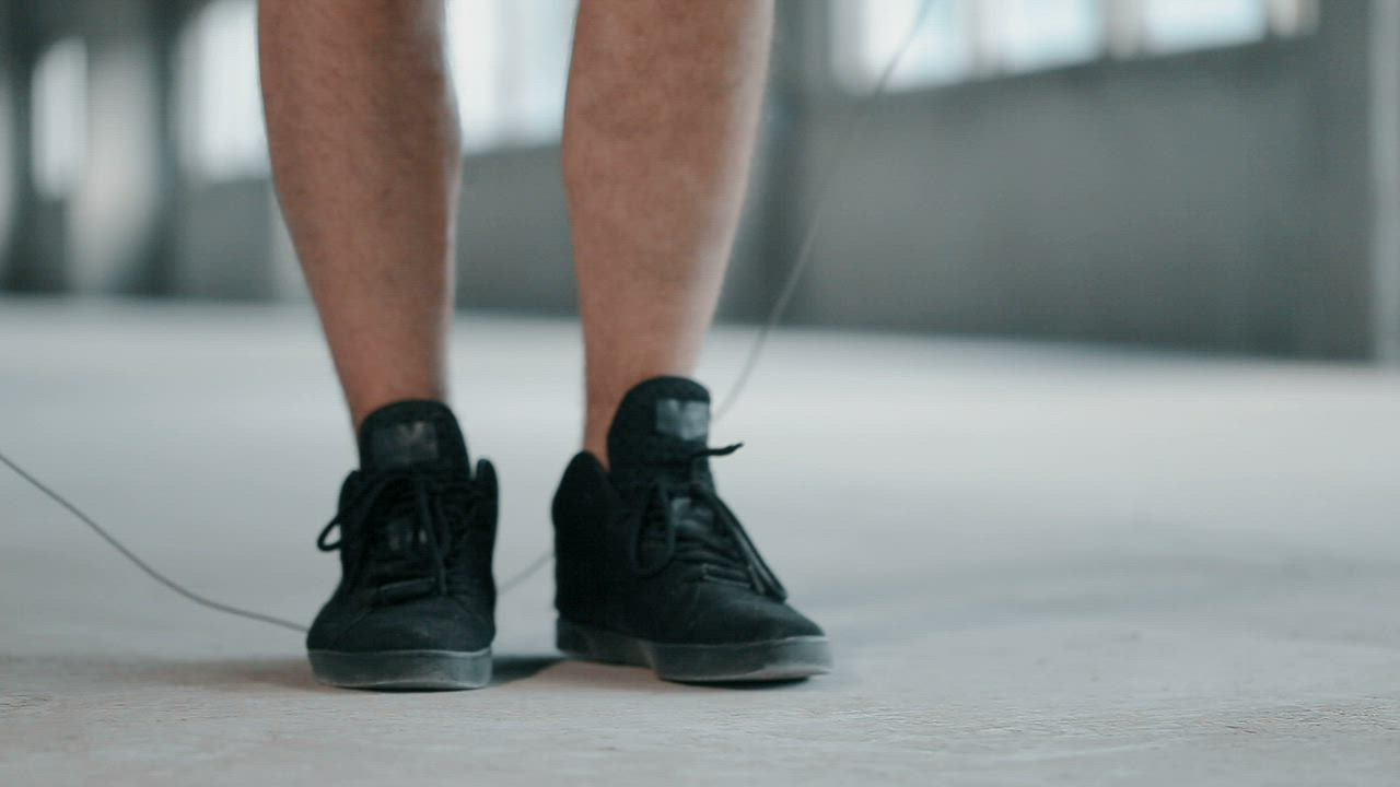 Feet of a man jumping rope - Free Stock Video