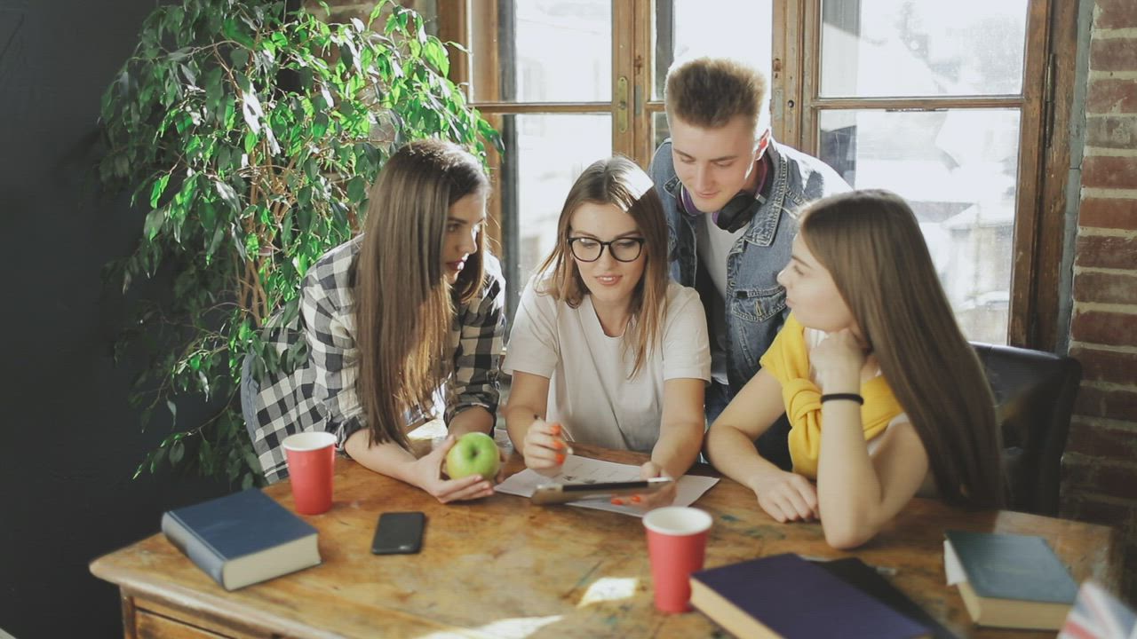 Students doing homework together at home - Free Stock Video