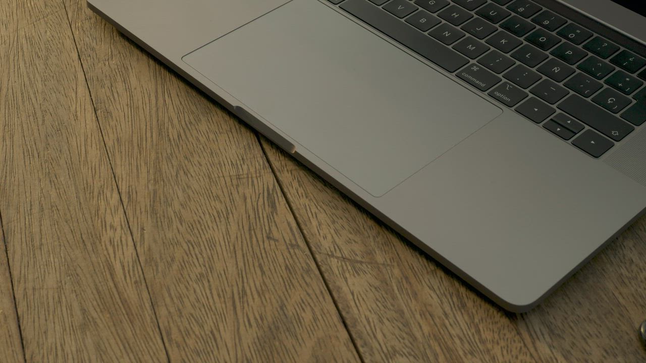 Laptop on a table - Free Stock Video