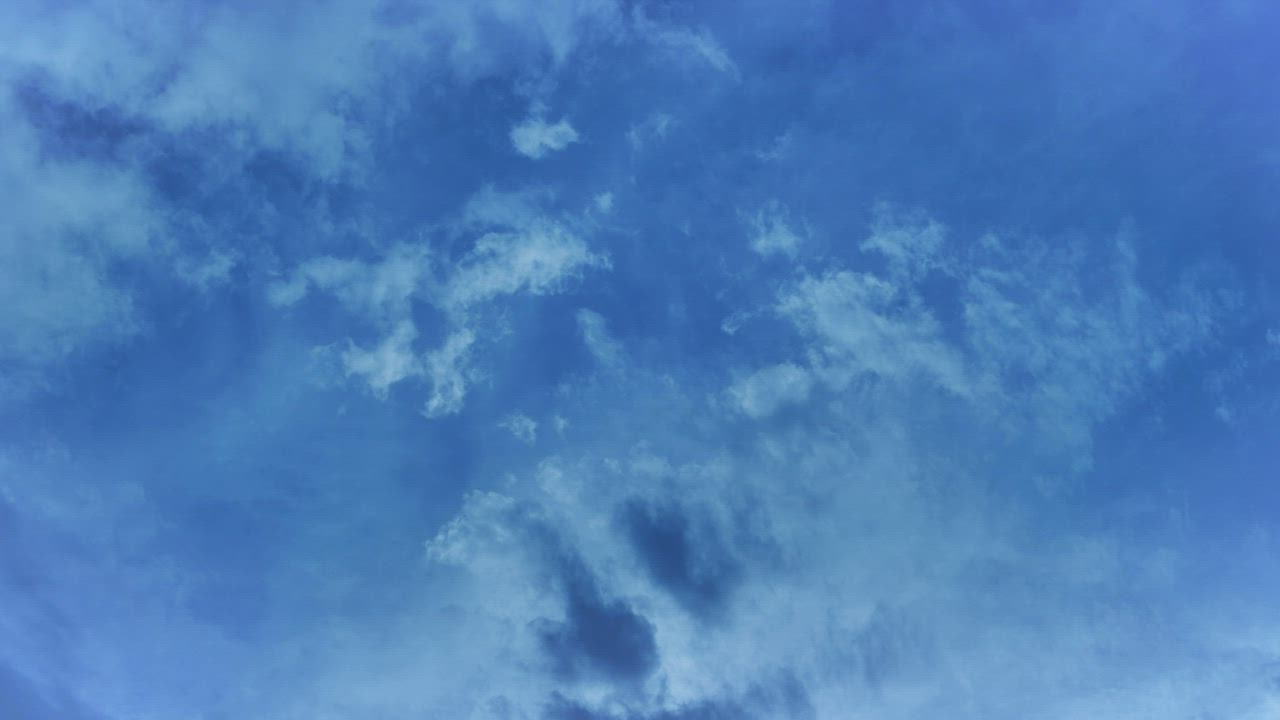 Blue sky seen directly with some clouds moving - Free Stock Video