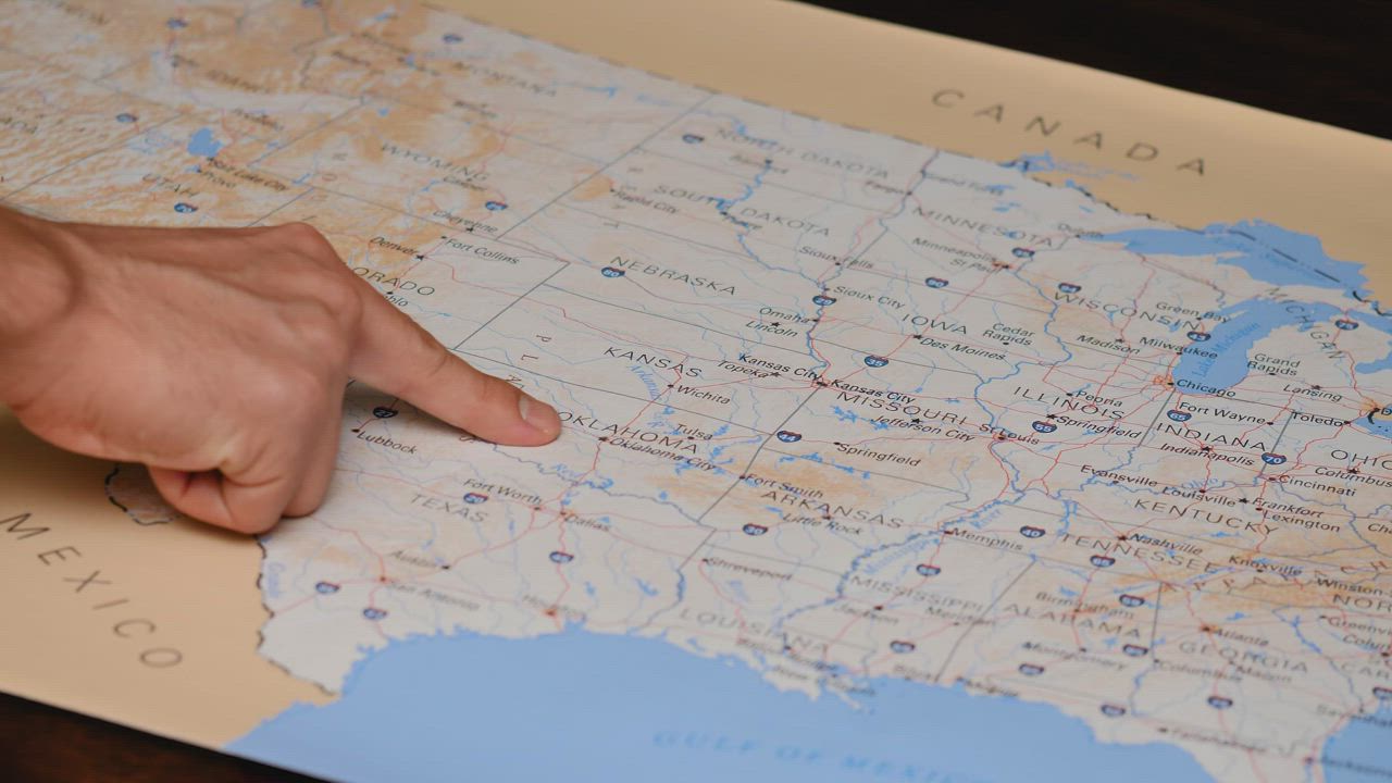 Person searching with his finger a place on a map of USA - Free Stock Video