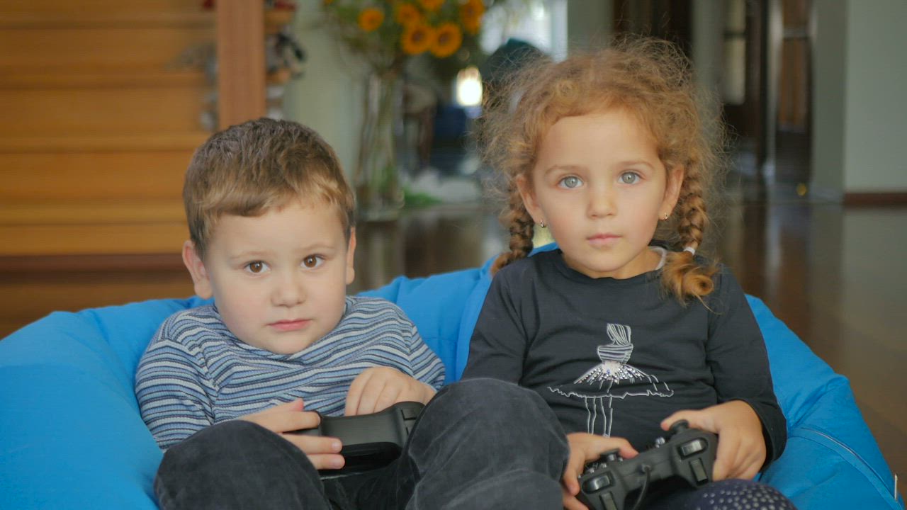 Little children playing video games - Free Stock Video