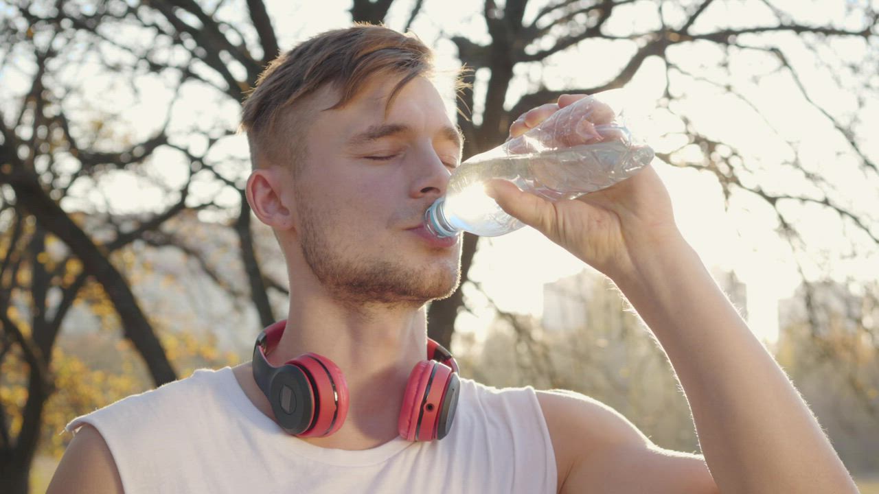 Athlete man drinking water in his training - Free Stock Video
