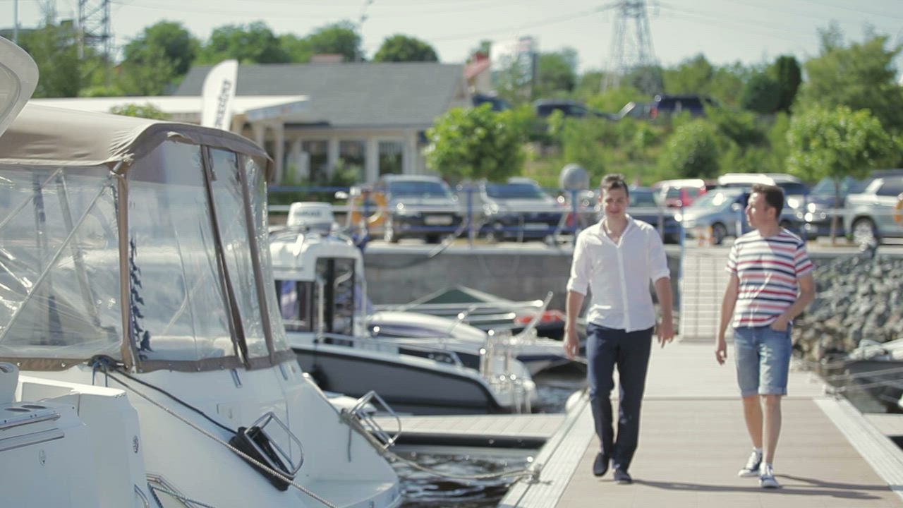 Yacht salesman with a young customer - Free Stock Video
