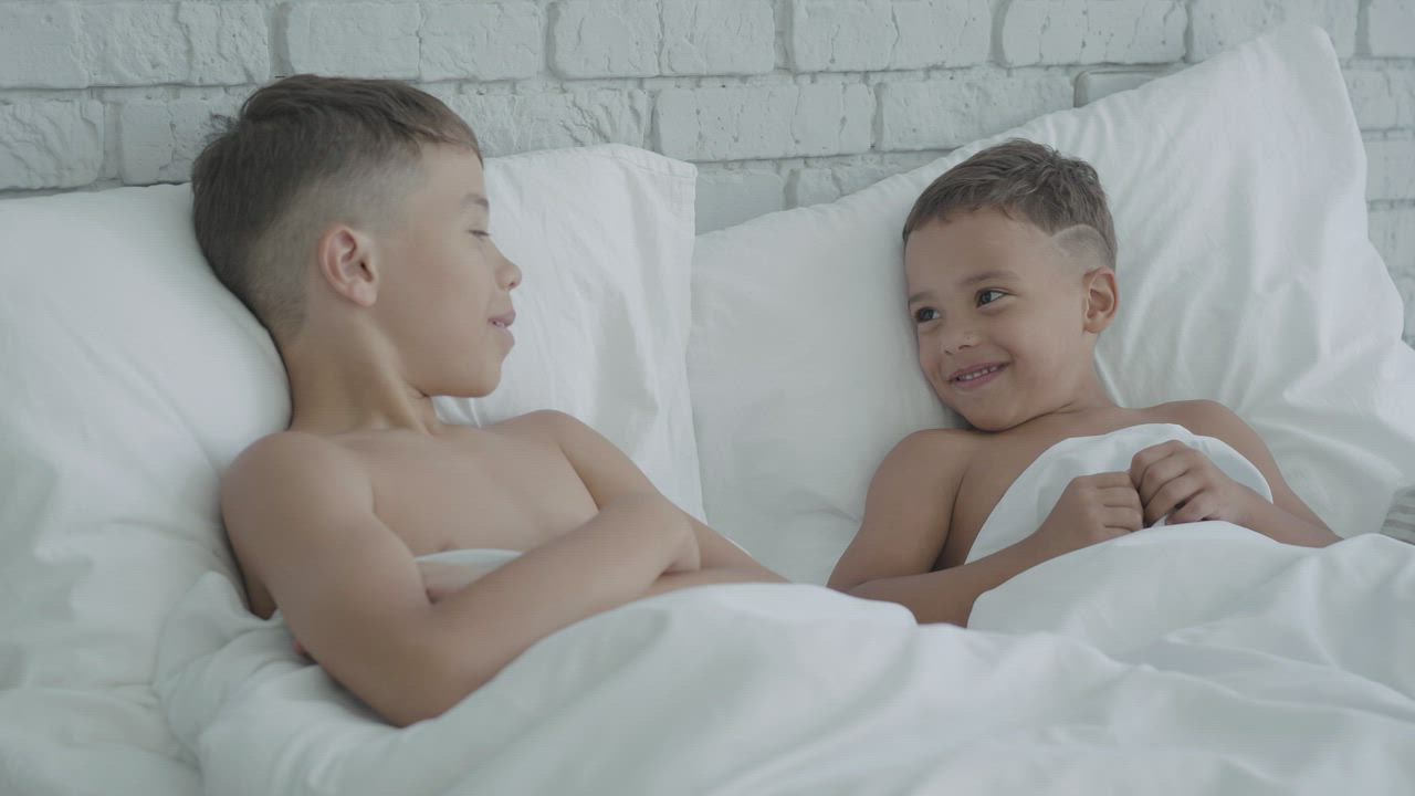 Little brothers tell each other secrets - Free Stock Video