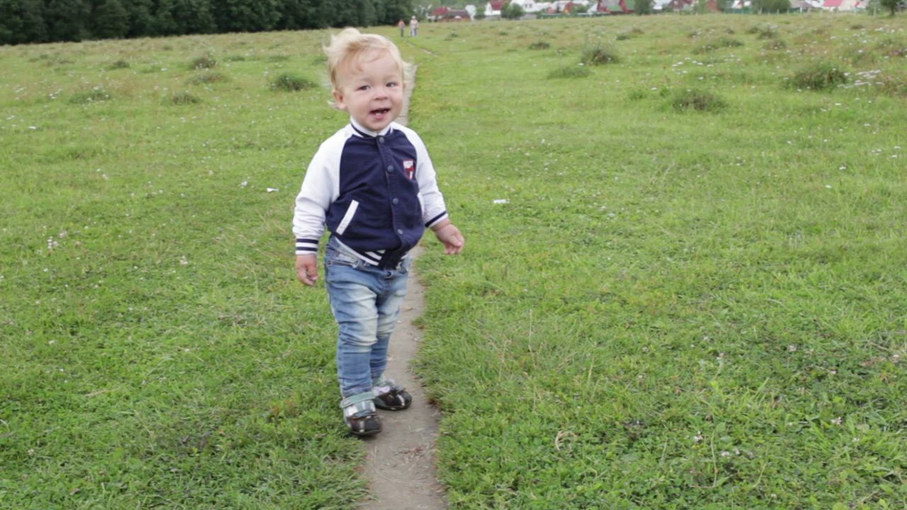 Happy toddler chasing the camera - Free Stock Video