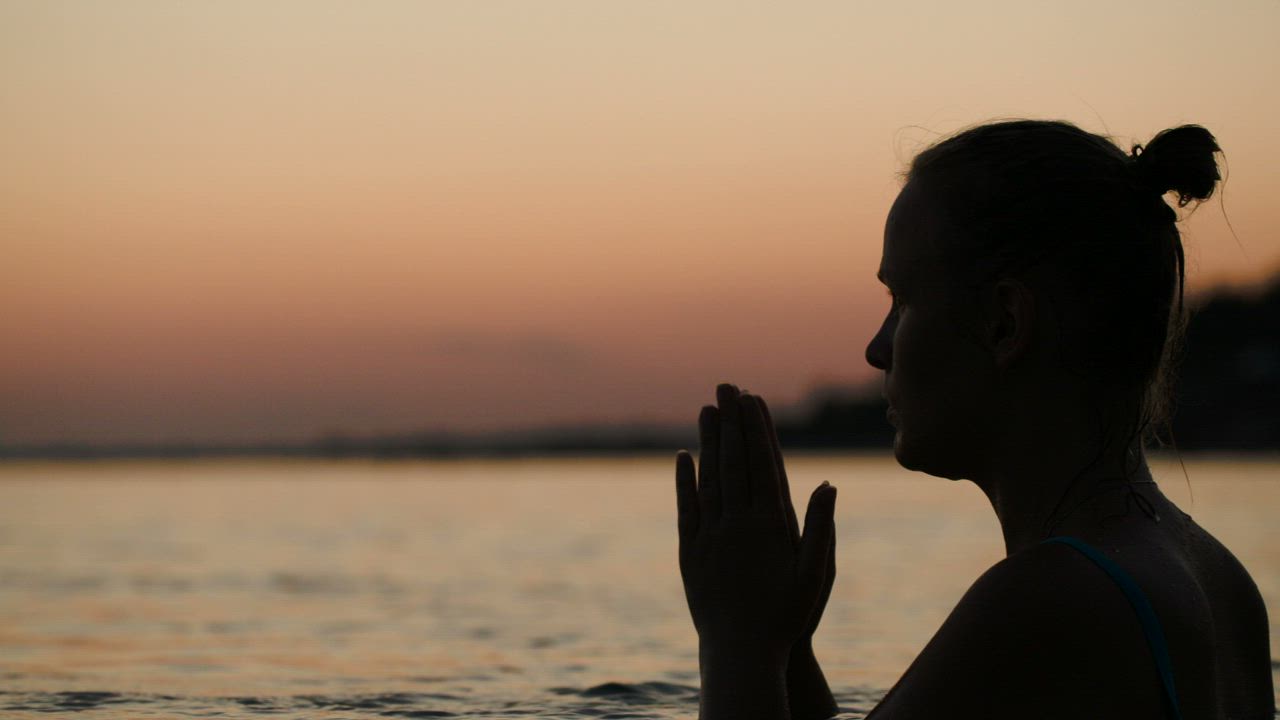 Praying in the ocean - Free Stock Video