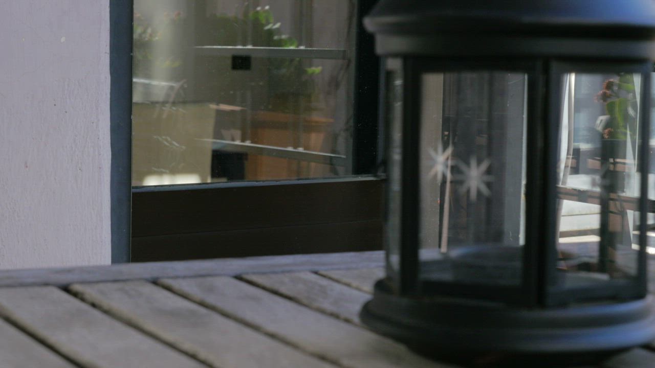 Woman setting a shop sign to open - Free Stock Video