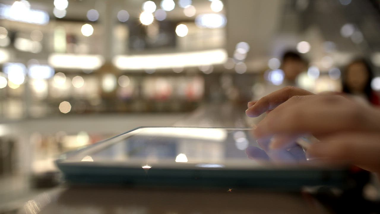 Using a tablet in a Mall - Free Stock Video